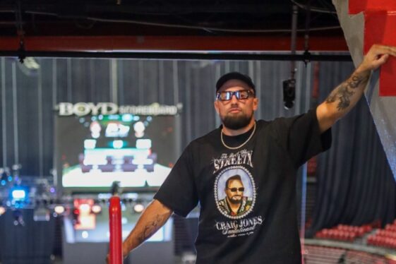 Craig Jones kisses Gabi Garcia before their CJI match